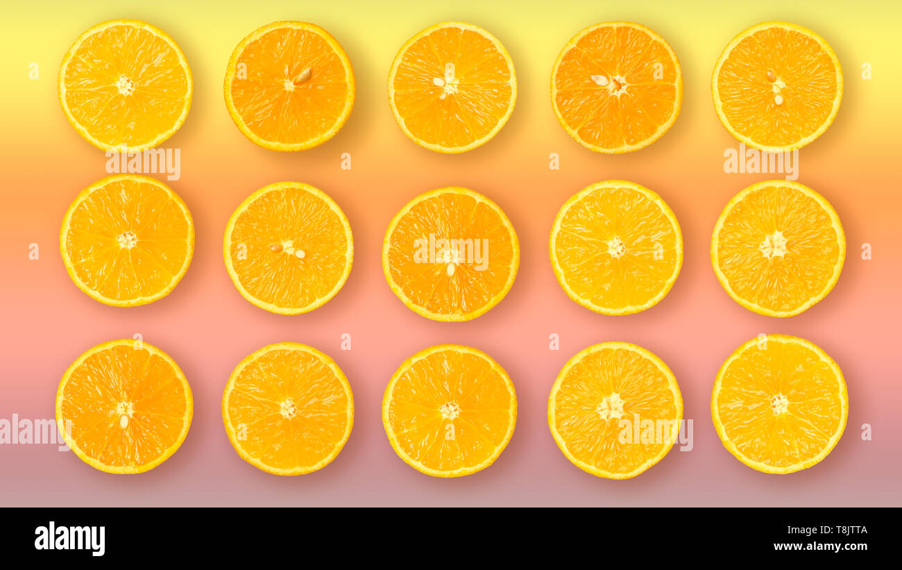 Background of half cut organic oranges in row on pastel colored ...