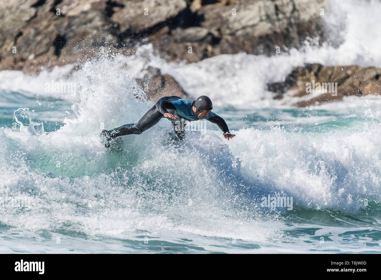 Spectacular surfing action as a surfer rides a wave at Fistral in ...