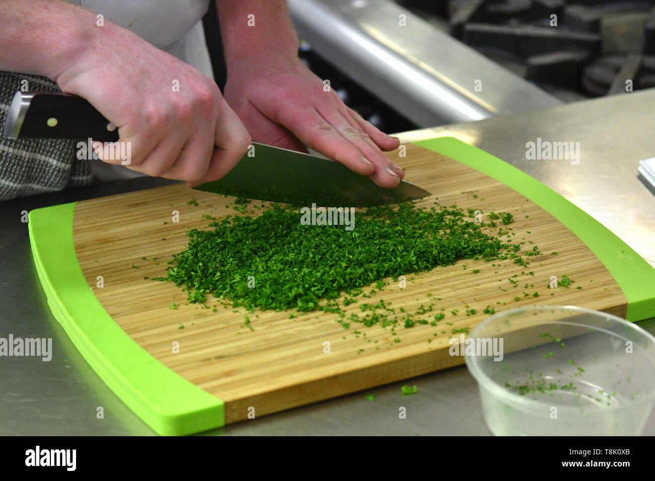 Organic woman chopping leaves hi-res stock photography and images - Alamy