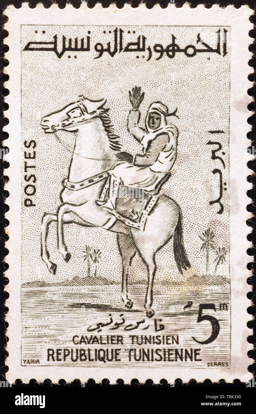 Tunisian rider greeting on postage stamp Stock Photo - Alamy