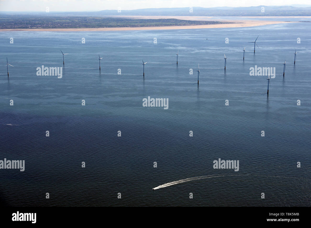 aerial view of a wind farm in the Irish Sea with the Wirral coast in ...