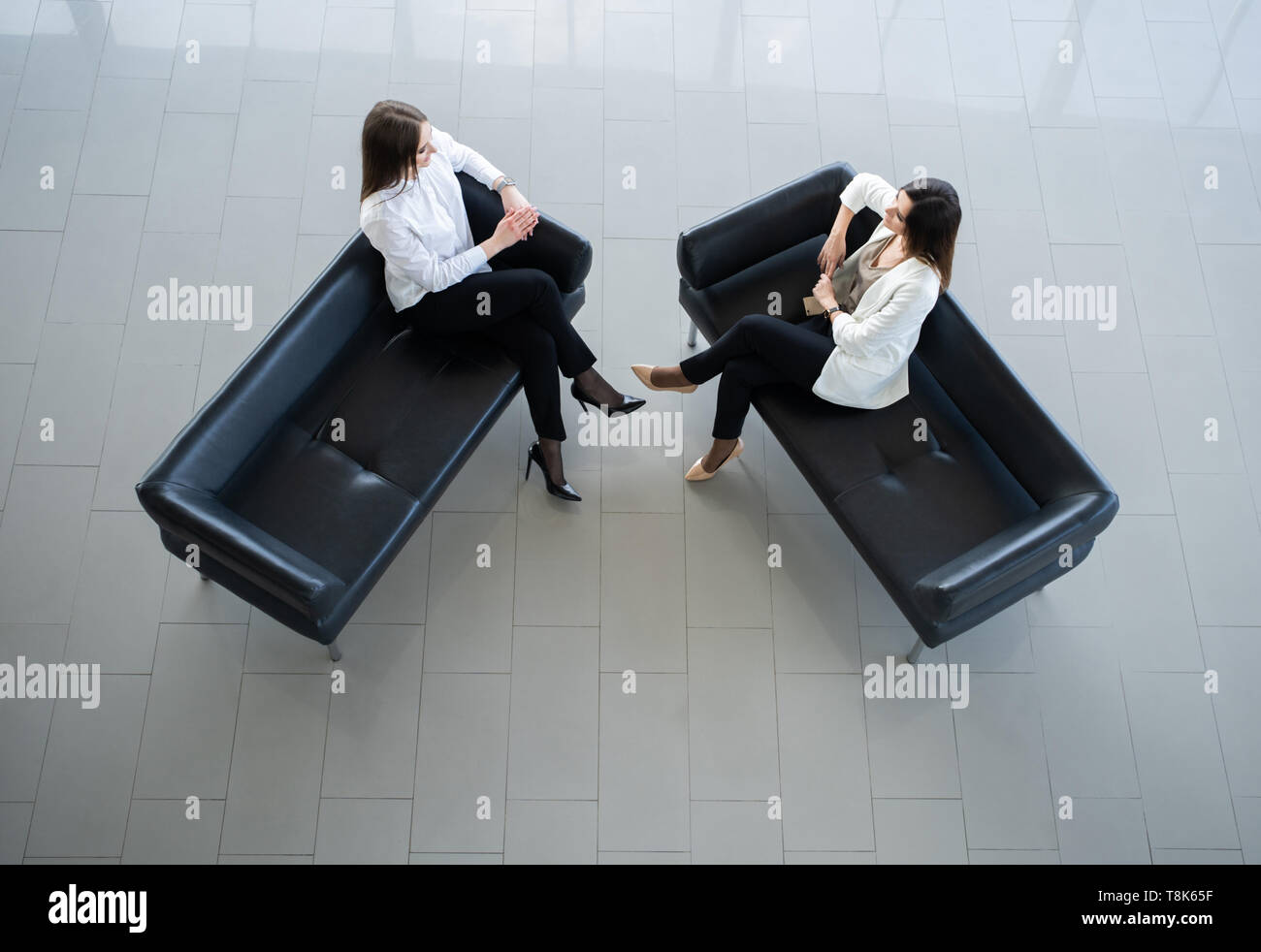 Top view of Two Businesswomen Meeting In Reception Of Modern Office ...