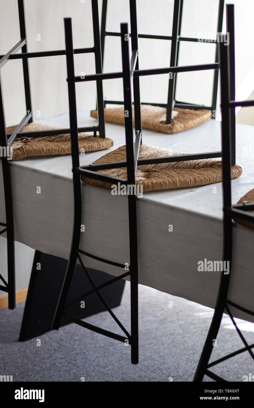 Upside down chairs on table hi-res stock photography and images - Alamy