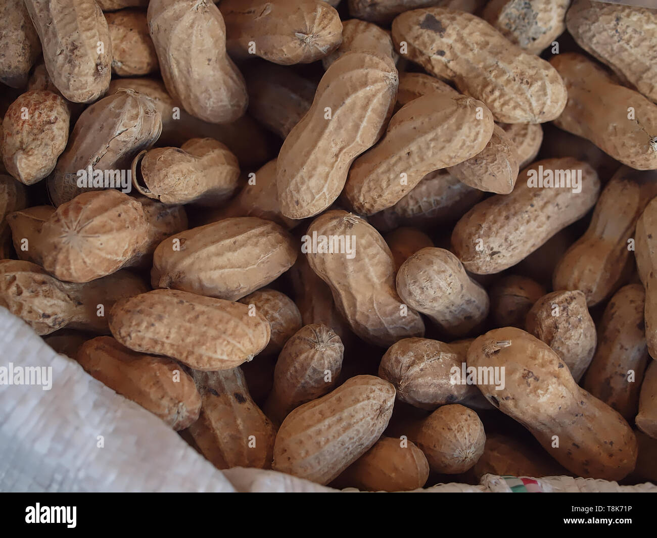 whole peanuts with shell at a food market Stock Photo - Alamy