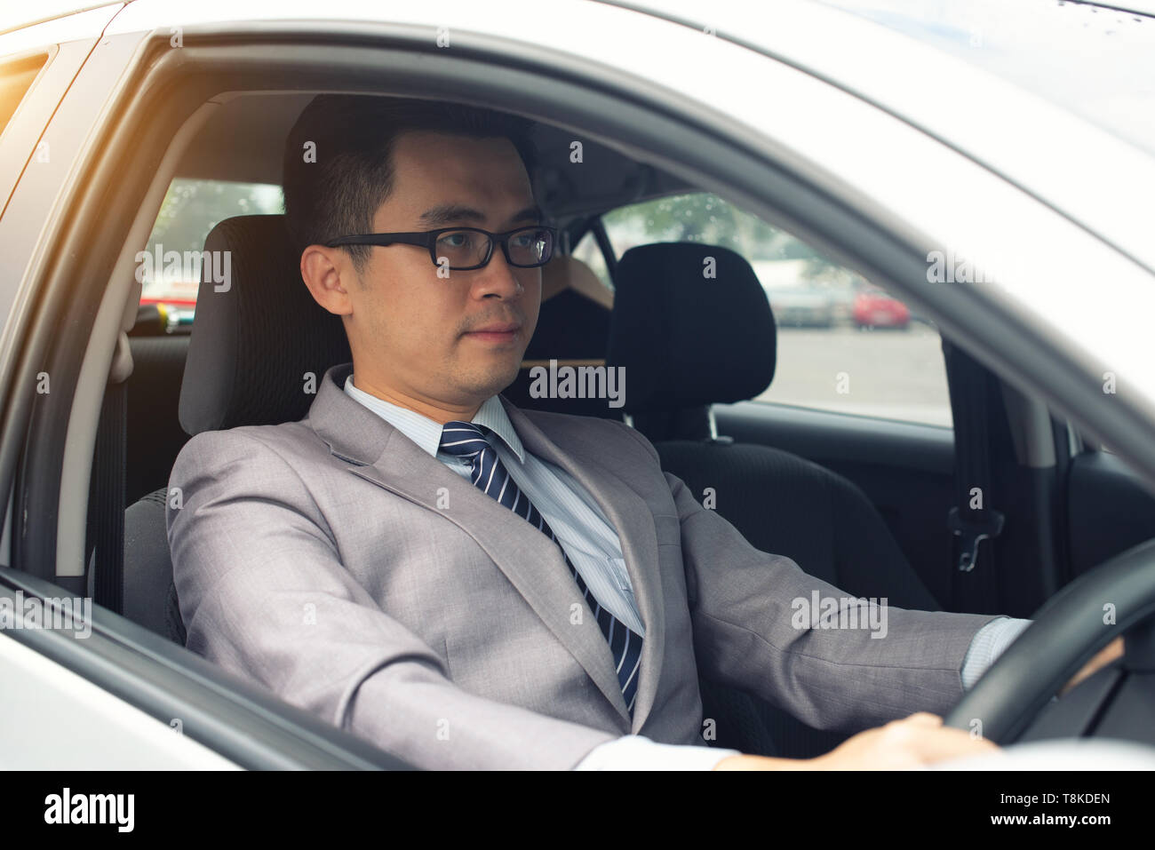 happy young business man driving in the car Stock Photo - Alamy
