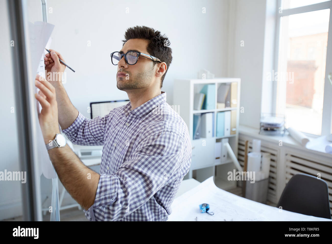 Engineer Planning Project in Office Stock Photo - Alamy