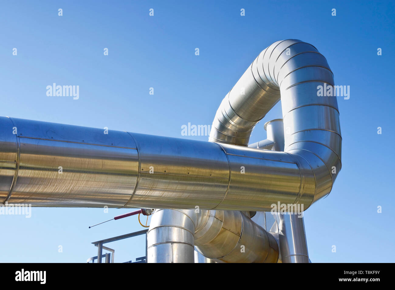 Geothermal power pipe structure against a blue background Stock Photo ...