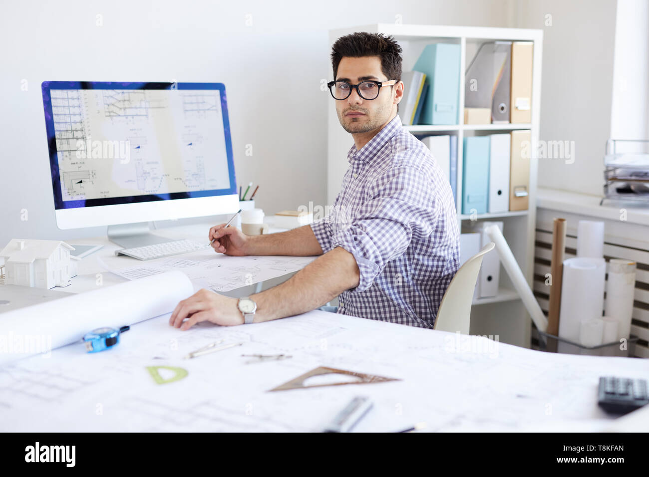 Contemporary Engineer at Workplace Stock Photo - Alamy