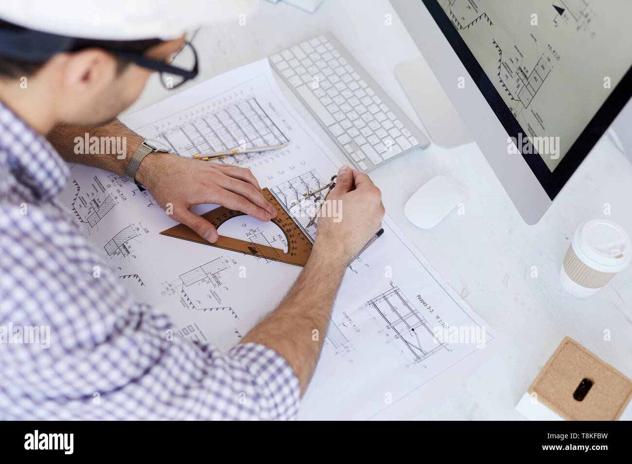 Engineer Drawing Plans High Angle Stock Photo - Alamy