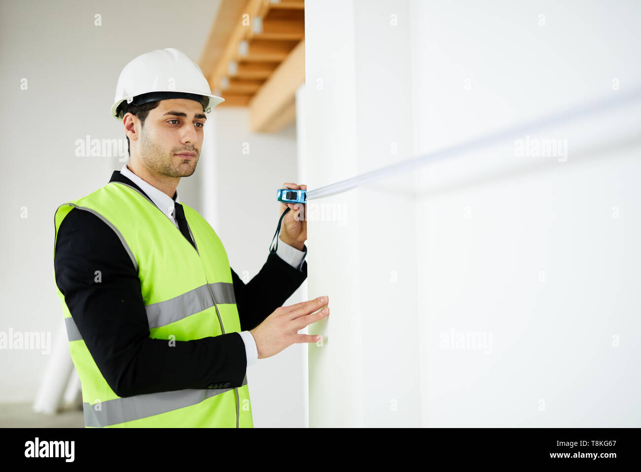 Engineer Measuring Walls Stock Photo - Alamy
