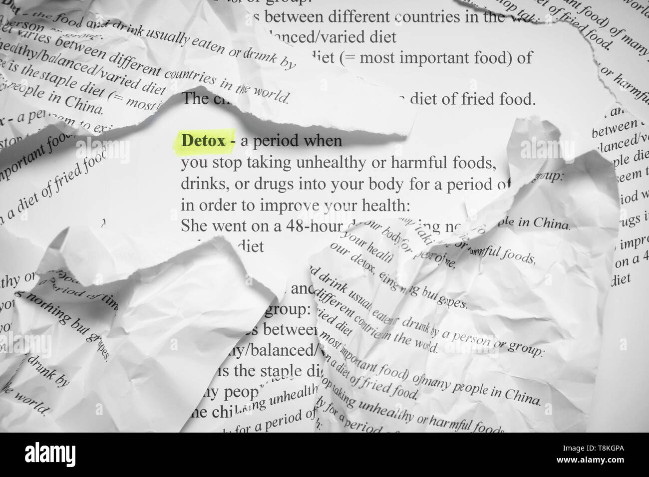 Sheets of paper and word DETOX highlighted with yellow marker Stock ...