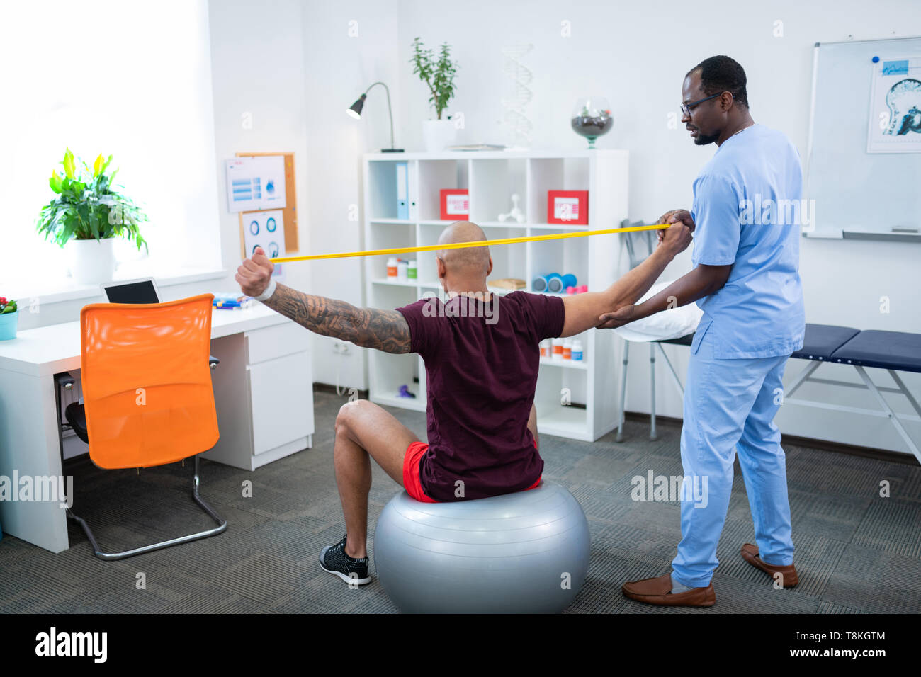 Man physical therapy stretching hi-res stock photography and images - Alamy