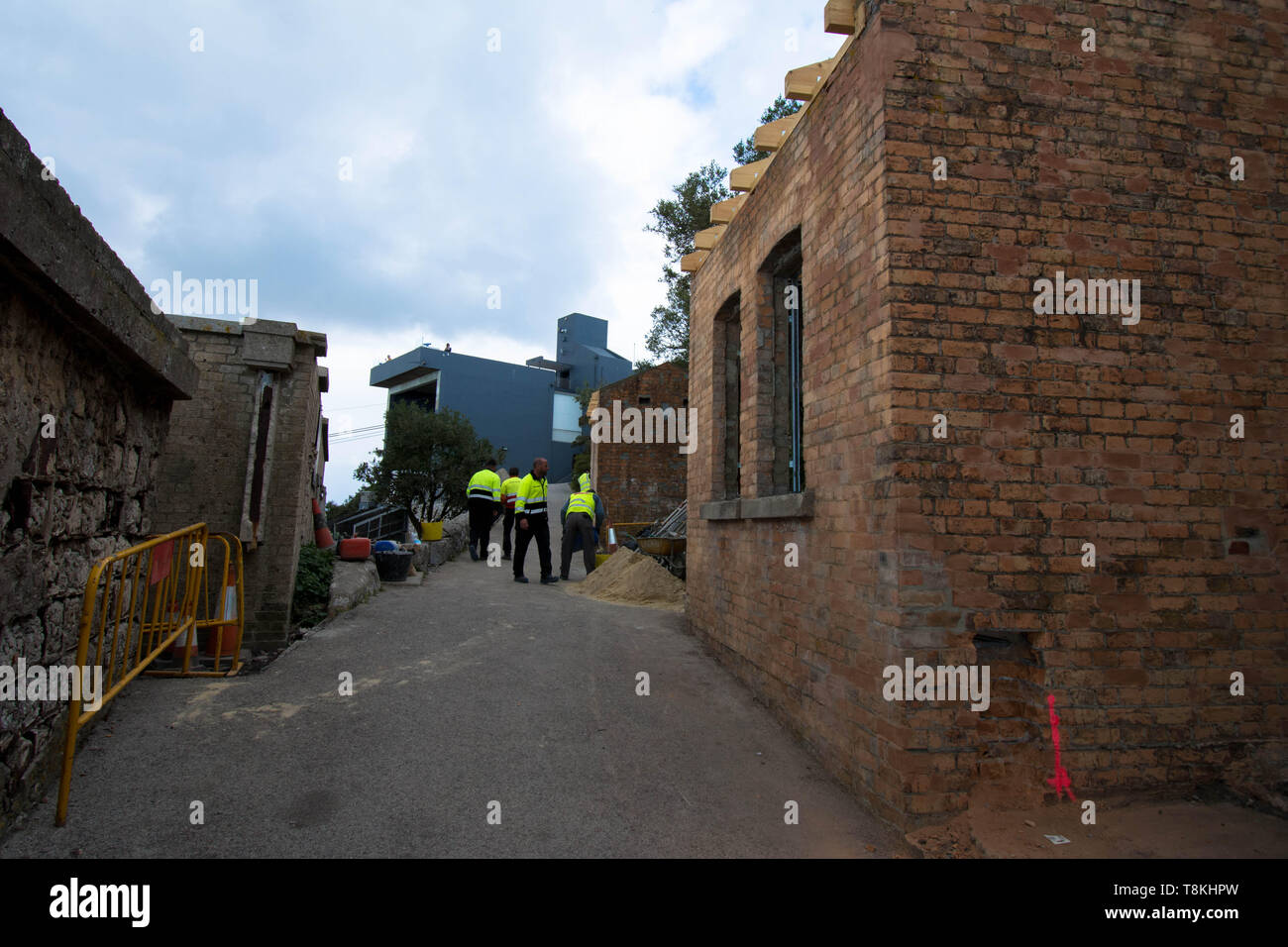 workers building restore wall British Barracks top of the rock ...
