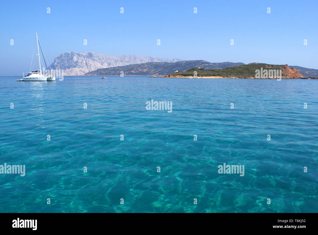 Yacht anchored in the turquoise waters of Capa Coda Cavallo, Olbia ...