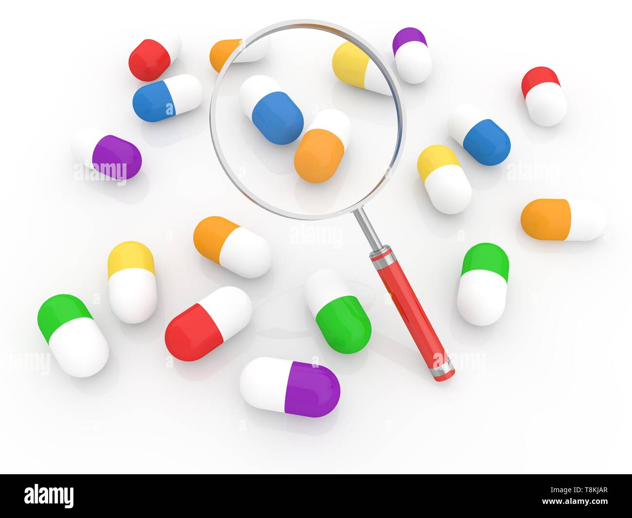 Magnifying glass and pills Cut Out Stock Images & Pictures - Alamy