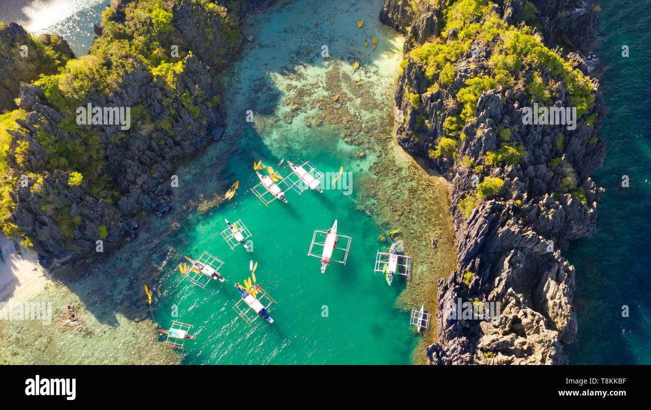Aerial drone view of kayaks inside a beautiful shallow tropical lagoon ...