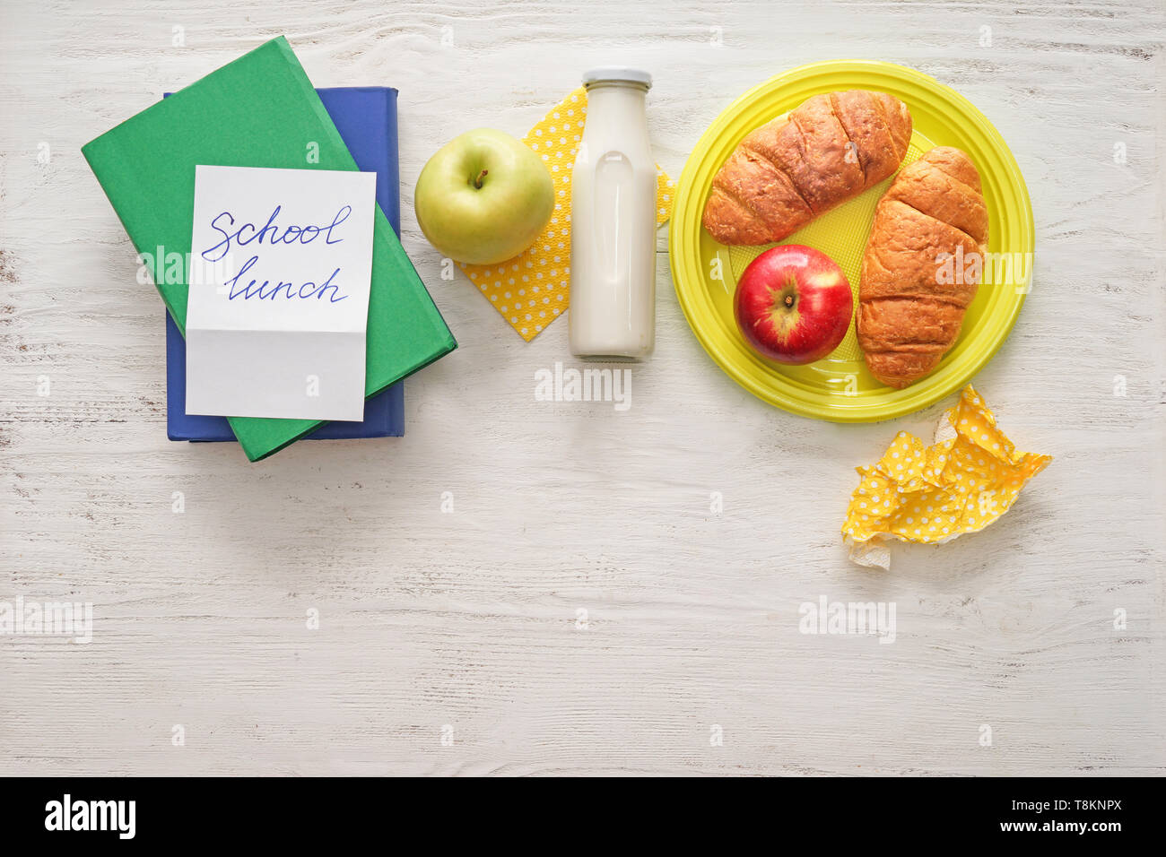Sheet of paper with words SCHOOL LUNCH and appetizing food on white ...