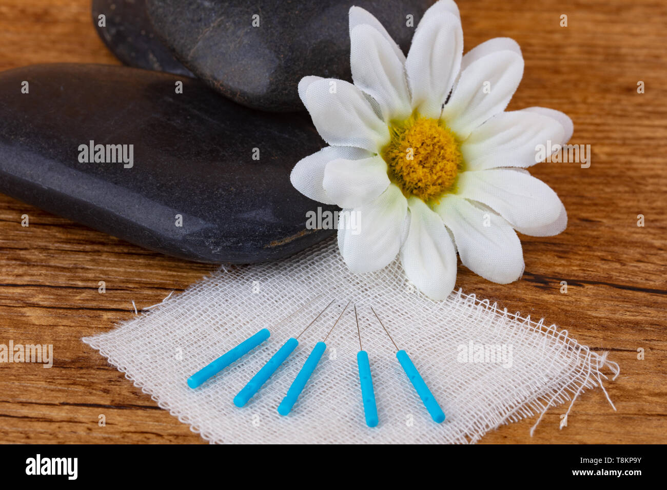 Acupuncture needles spa stones hi-res stock photography and images - Alamy
