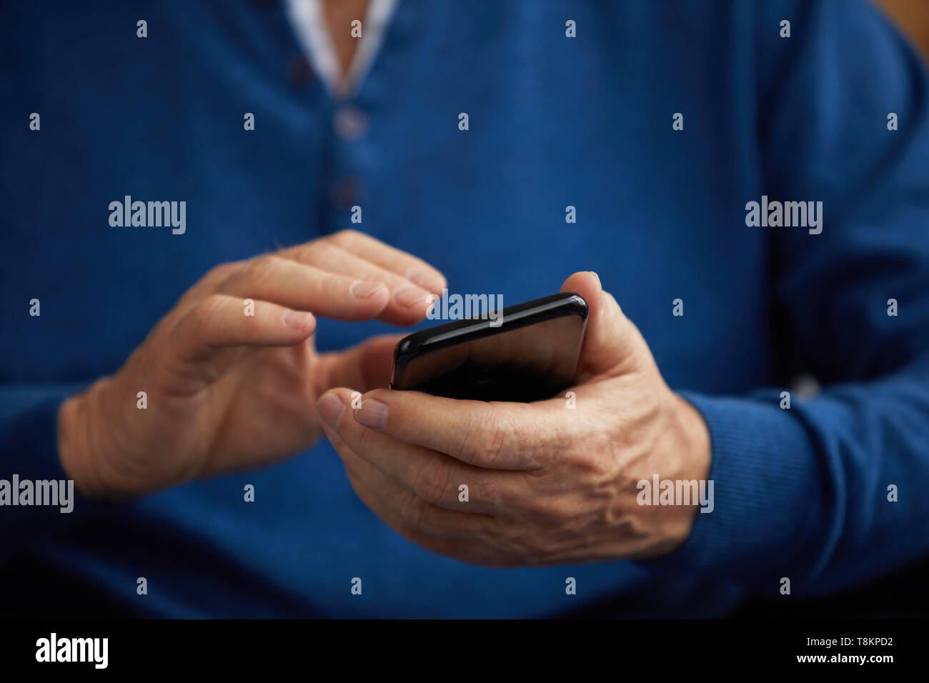 Senior Man Holding Smartphone Stock Photo - Alamy