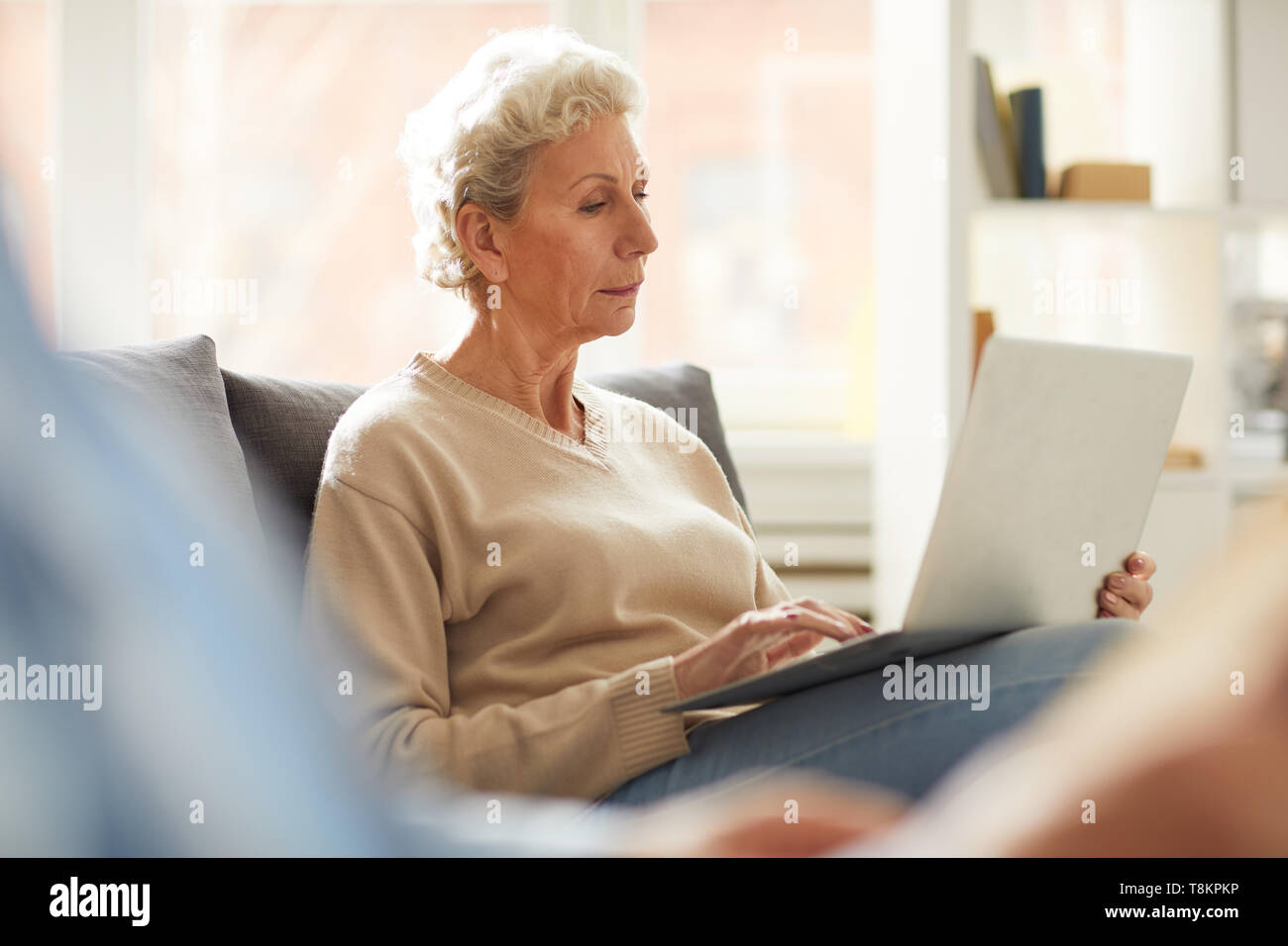 Beautiful senior woman sitting laptop hi-res stock photography and ...