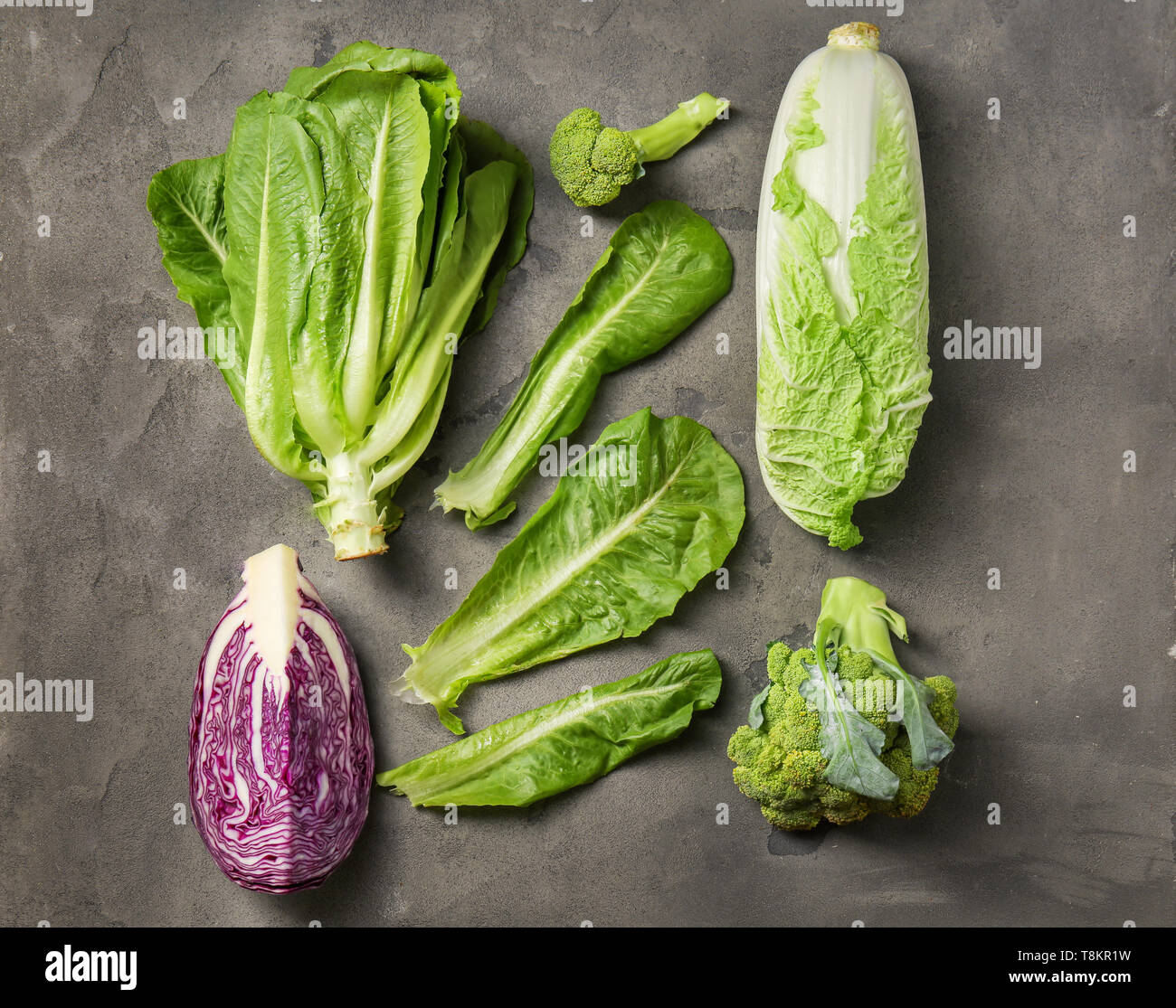 Different types of cabbage on grey background Stock Photo - Alamy