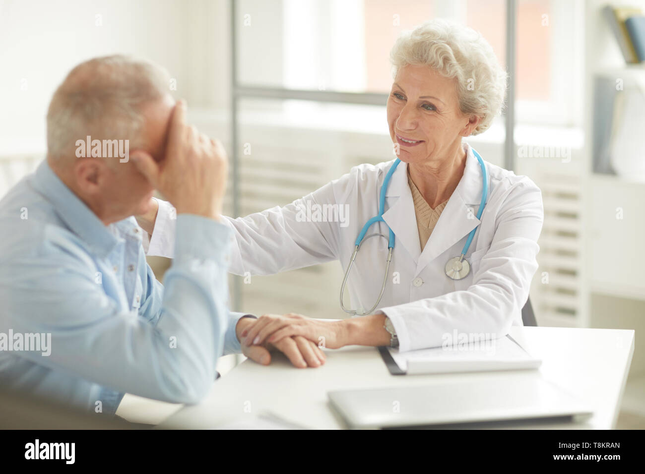 Doctor Supporting Patient Stock Photo - Alamy