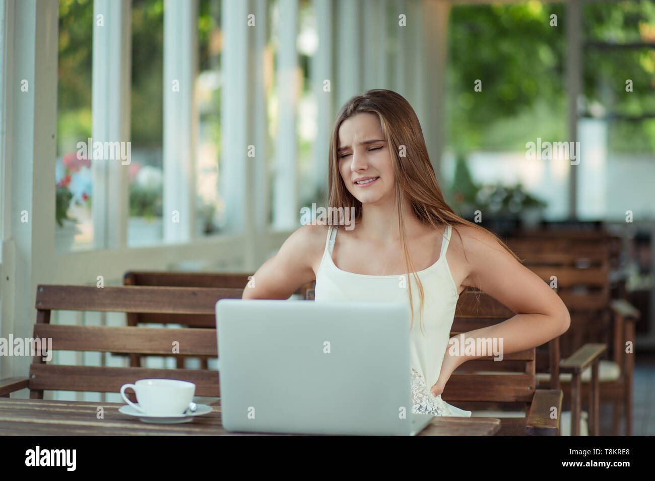 Backpain woman sitting High Resolution Stock Photography and Images - Alamy