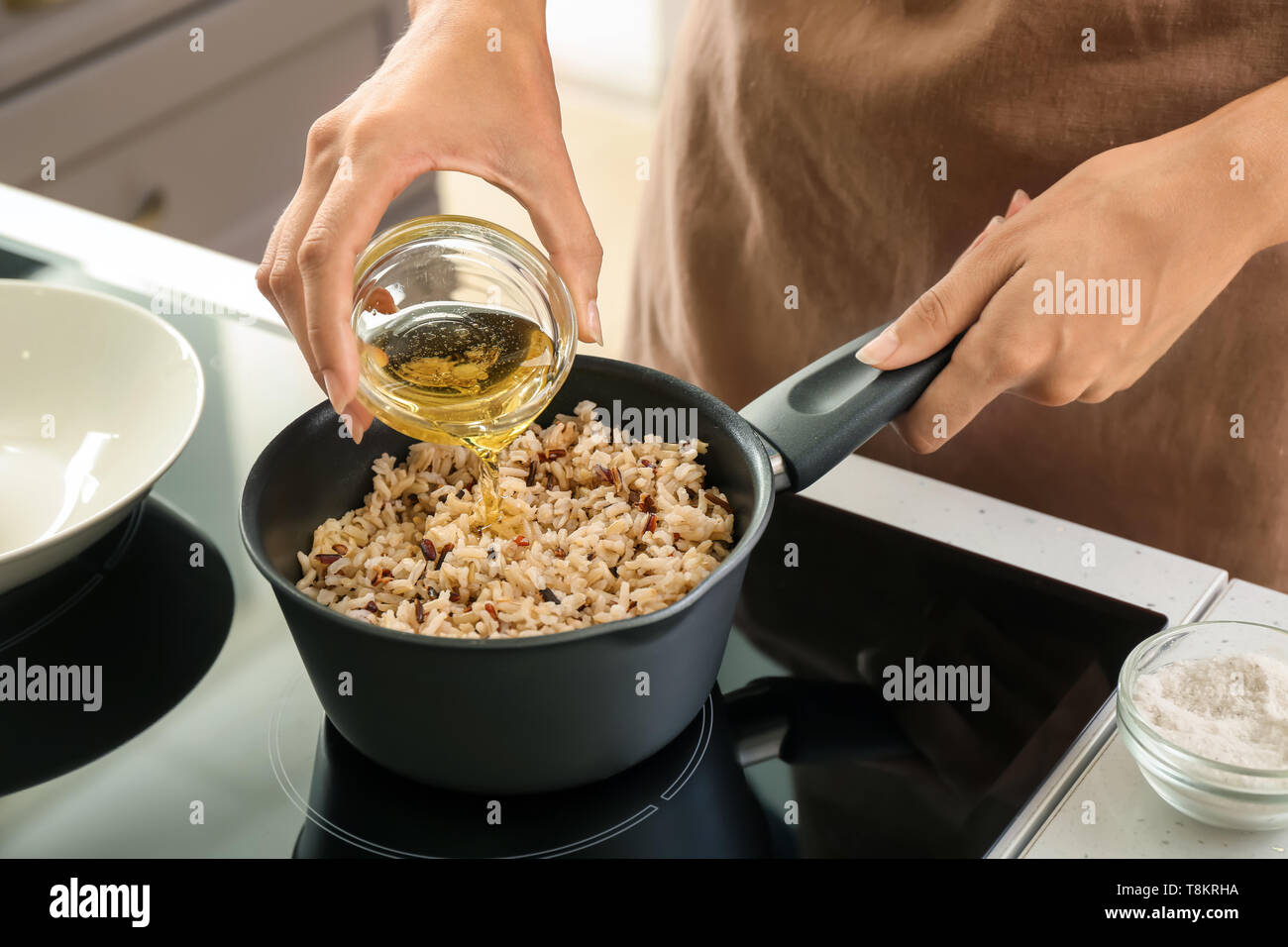 Woman hands pouring oil hot hi-res stock photography and images - Alamy