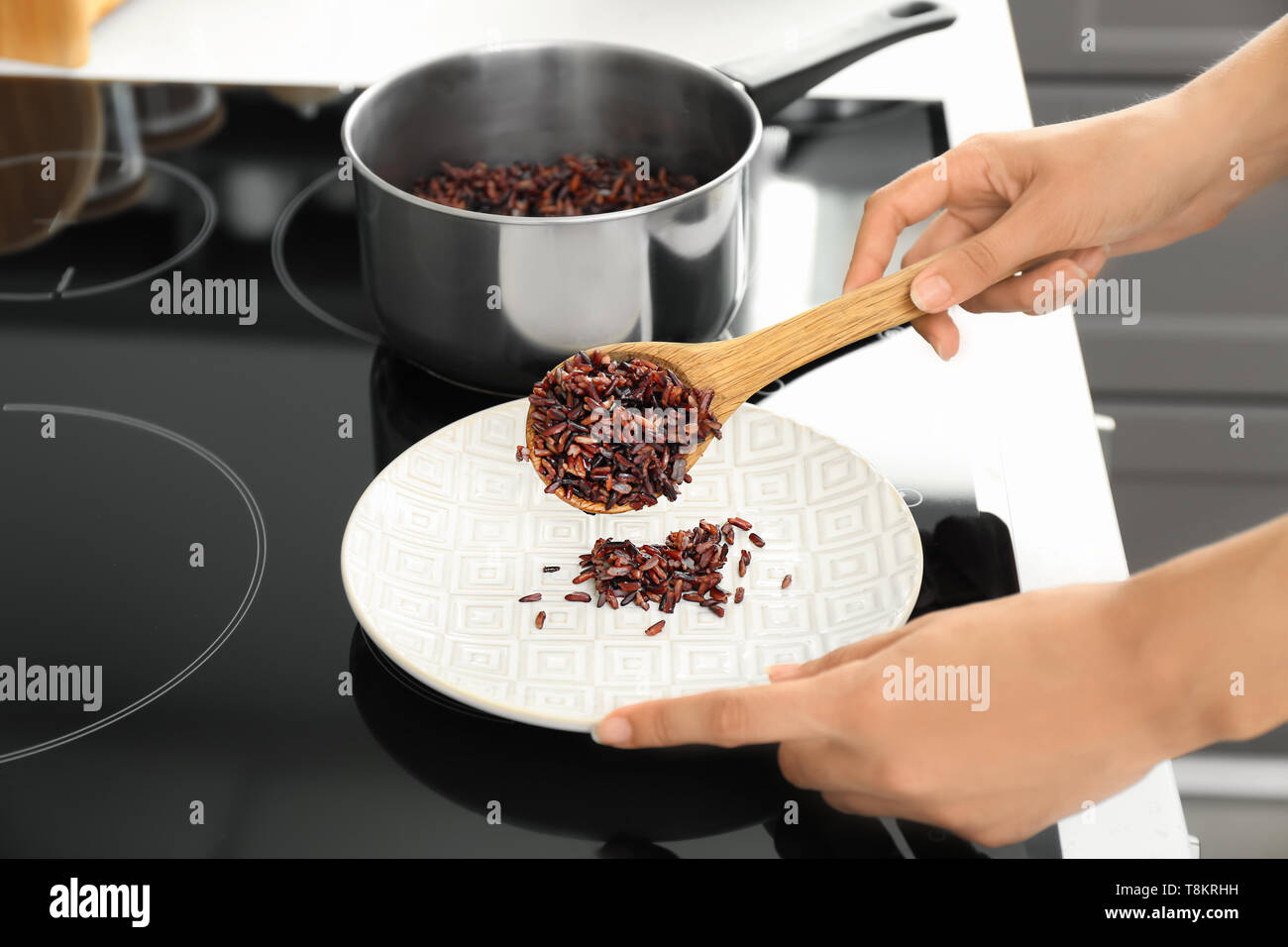 Woman putting plate rice hi-res stock photography and images - Alamy