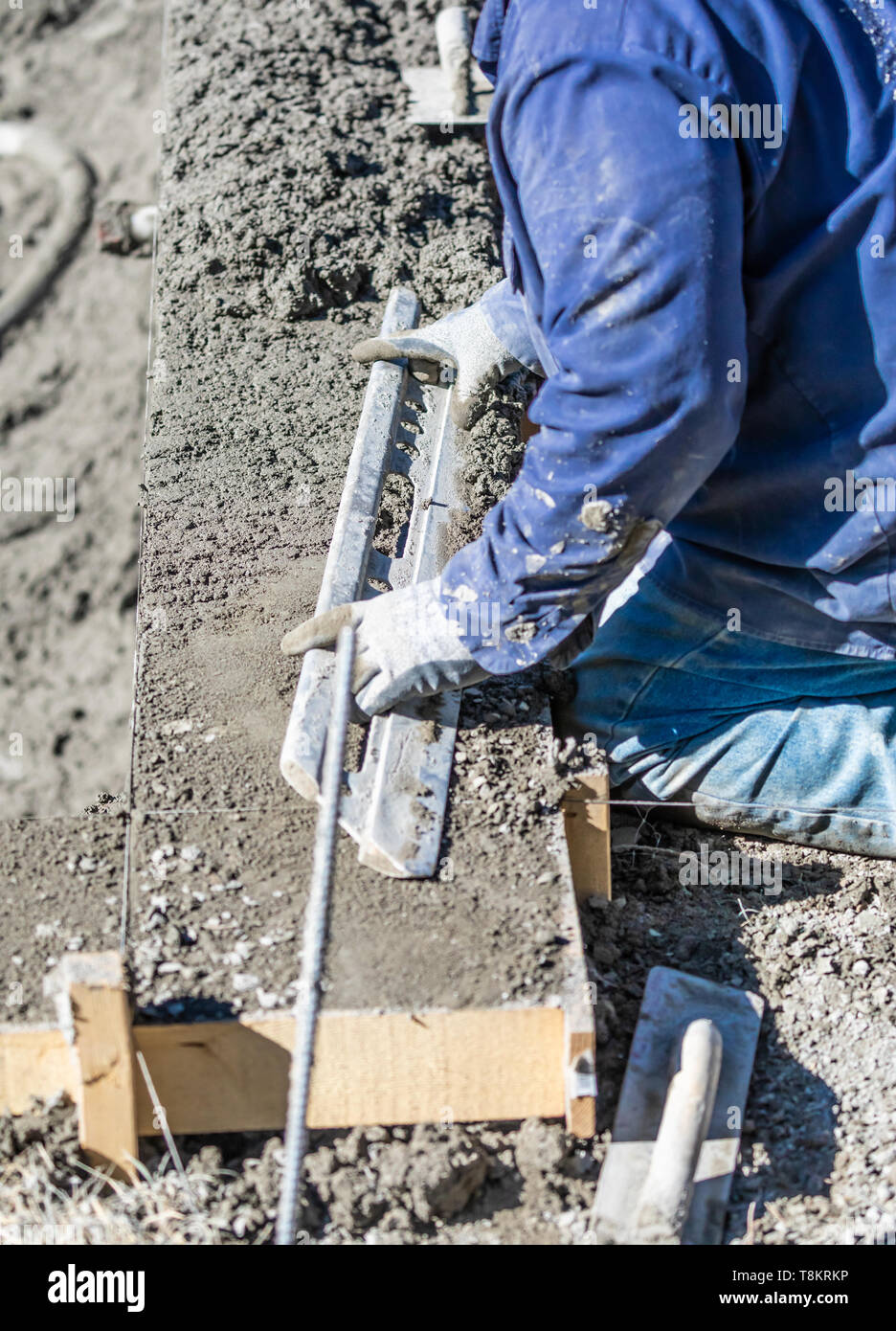 Pool Construction Worker Working With A Smoother Rod On Wet Concrete ...