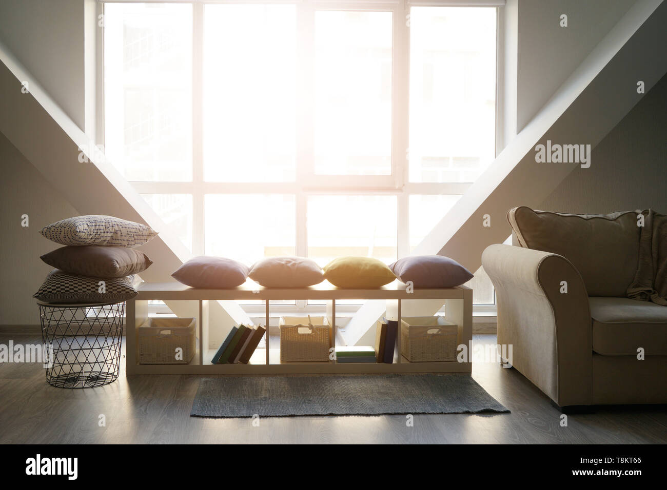 Cozy place for rest with soft pillows near window Stock Photo - Alamy