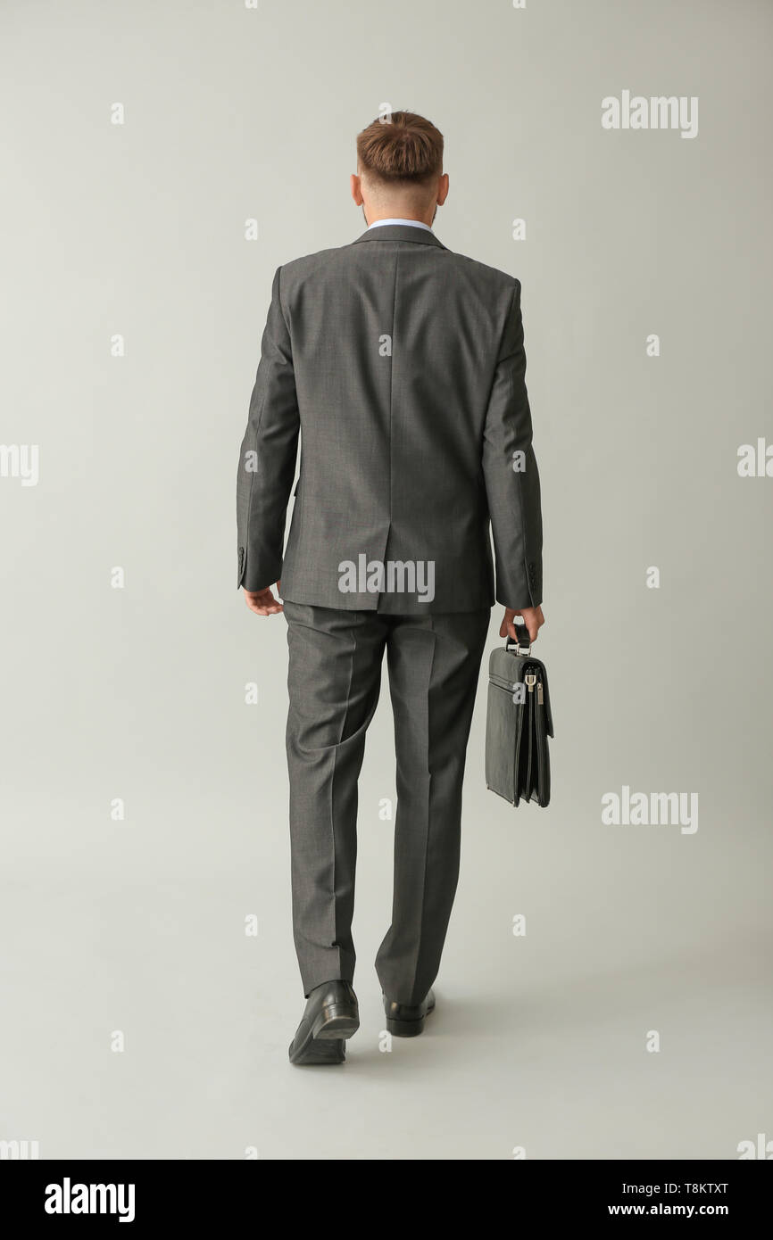 Back view manager walking hi-res stock photography and images - Alamy