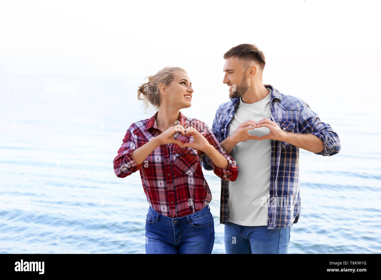 People making hearts with their hands hi-res stock photography and ...