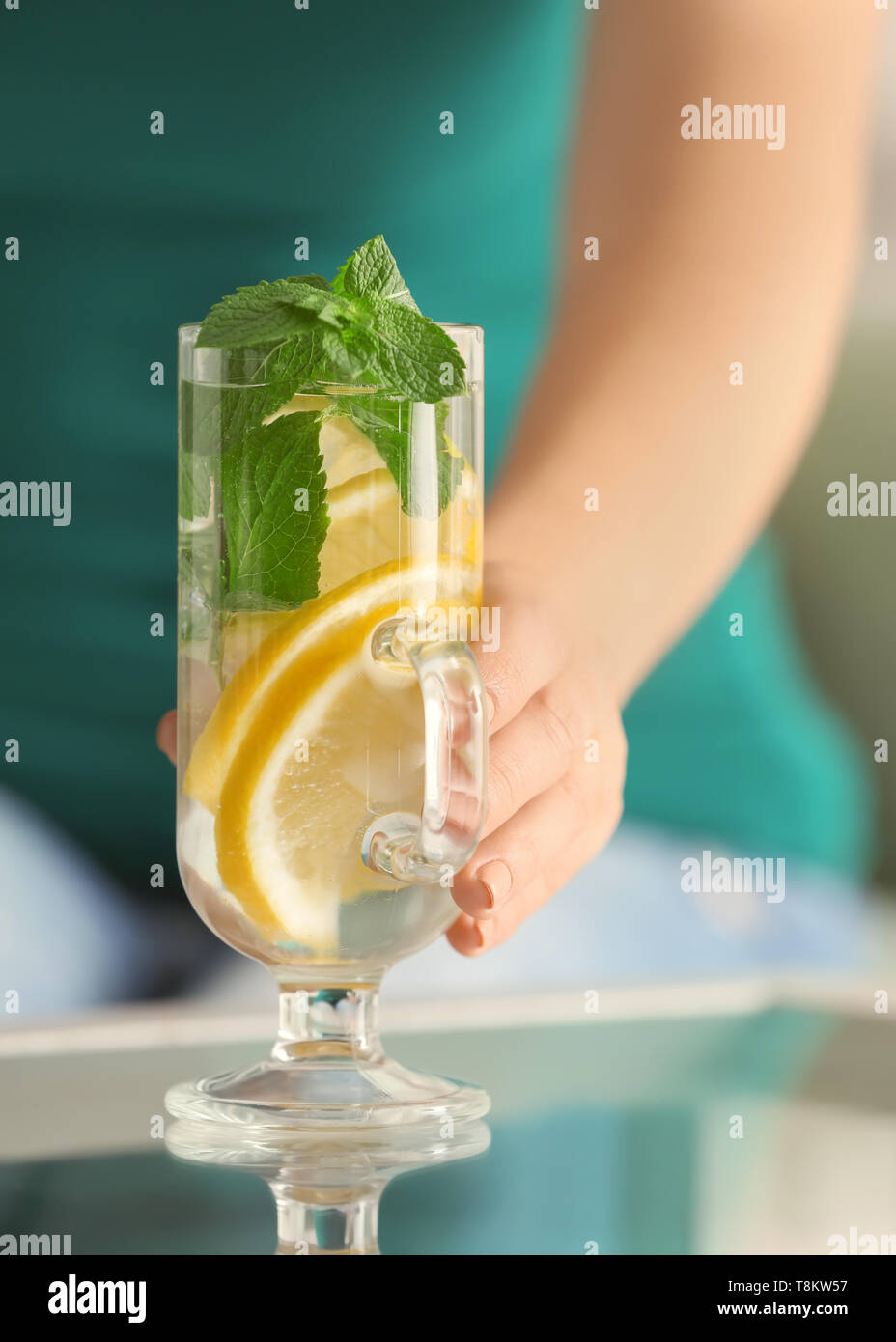 Woman taking cut lemon from hi-res stock photography and images - Alamy