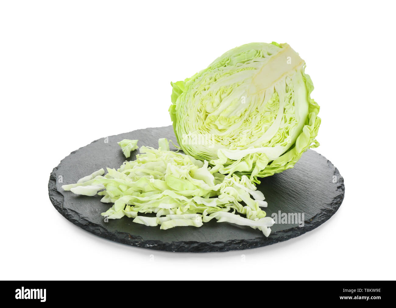 Slate plate with cut cabbage on white background Stock Photo - Alamy