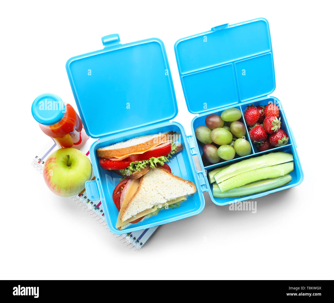 Lunch boxes with appetizing food and notebook on white background Stock ...