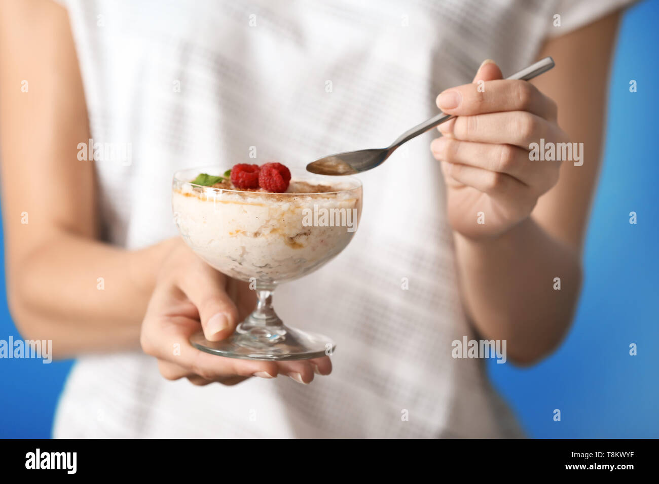 Woman eating rice pudding hi-res stock photography and images - Alamy