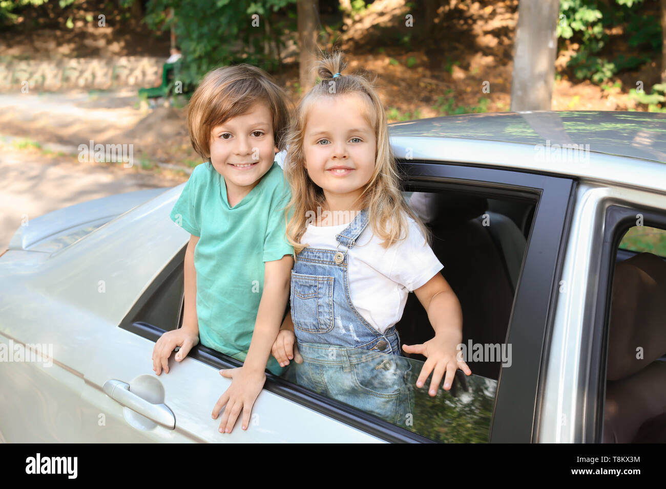 Cute little children in car Stock Photo - Alamy