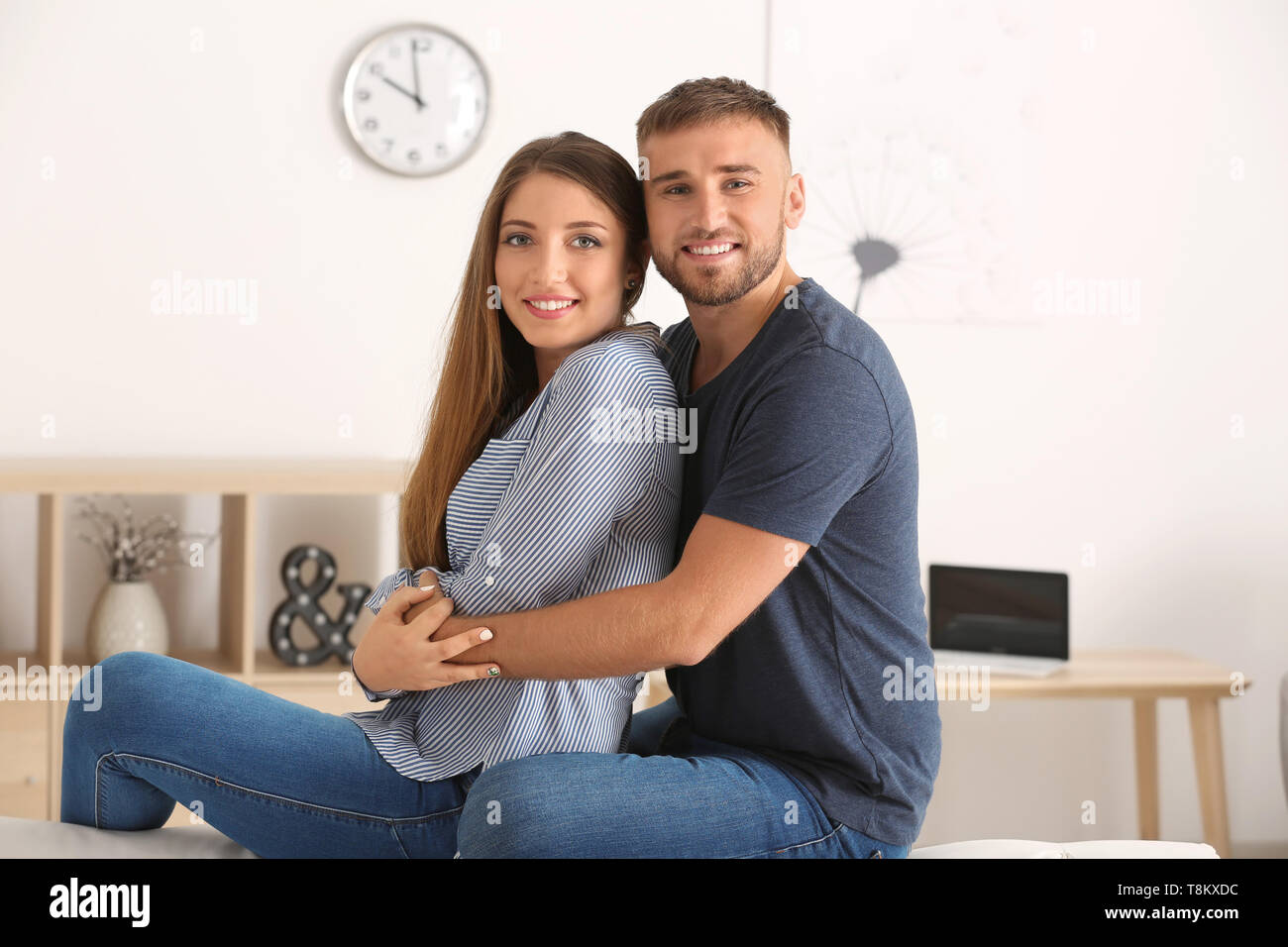 Happy loving couple resting at home Stock Photo - Alamy