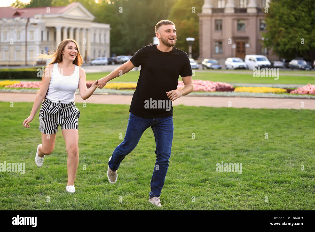 Lovely couple running together hi-res stock photography and images - Alamy