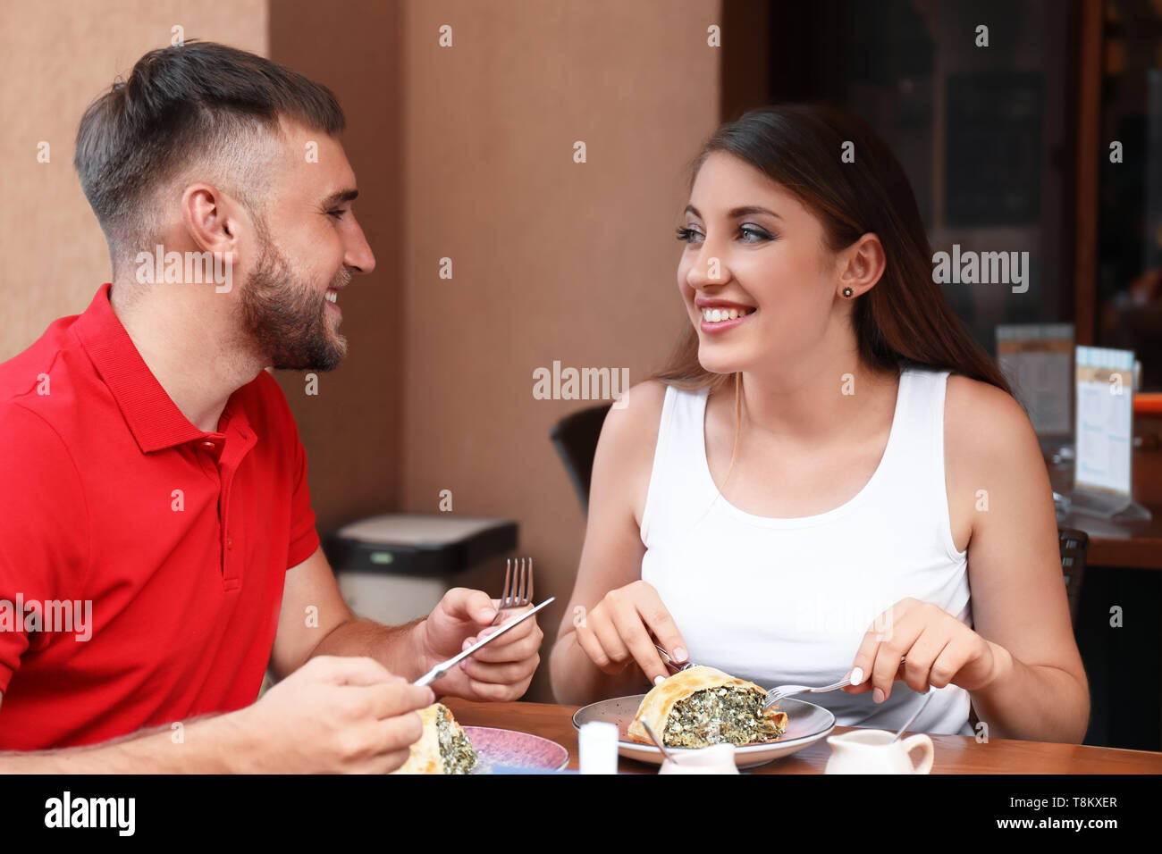 Couple eating in cafe hi-res stock photography and images - Alamy