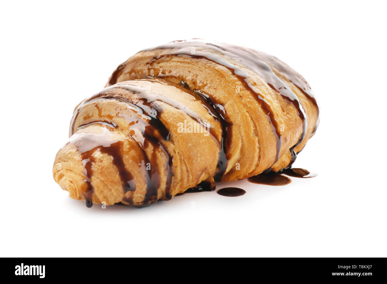 Tasty croissant with chocolate syrup on white background Stock Photo ...