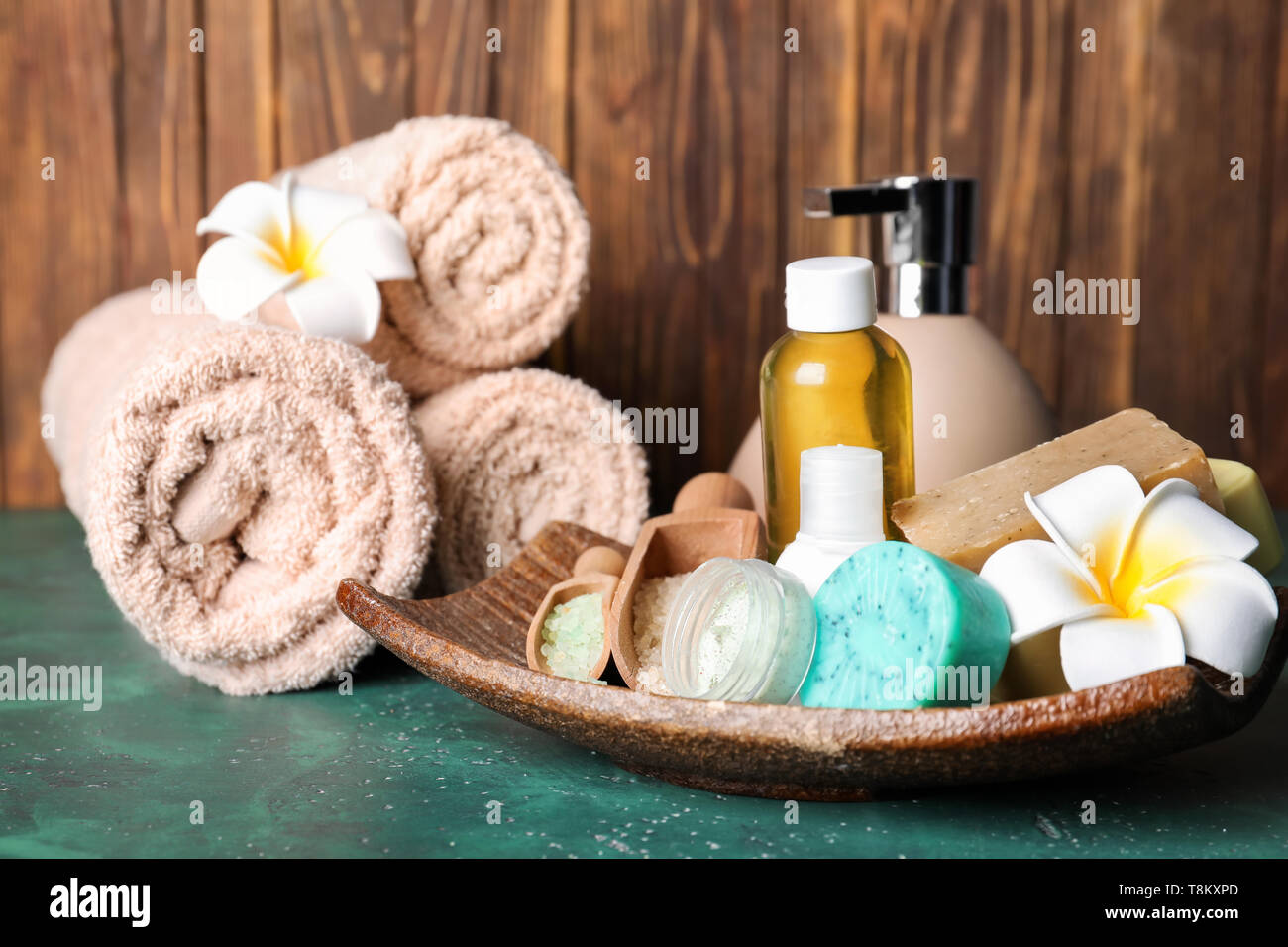 Plate with bath products on color table Stock Photo - Alamy