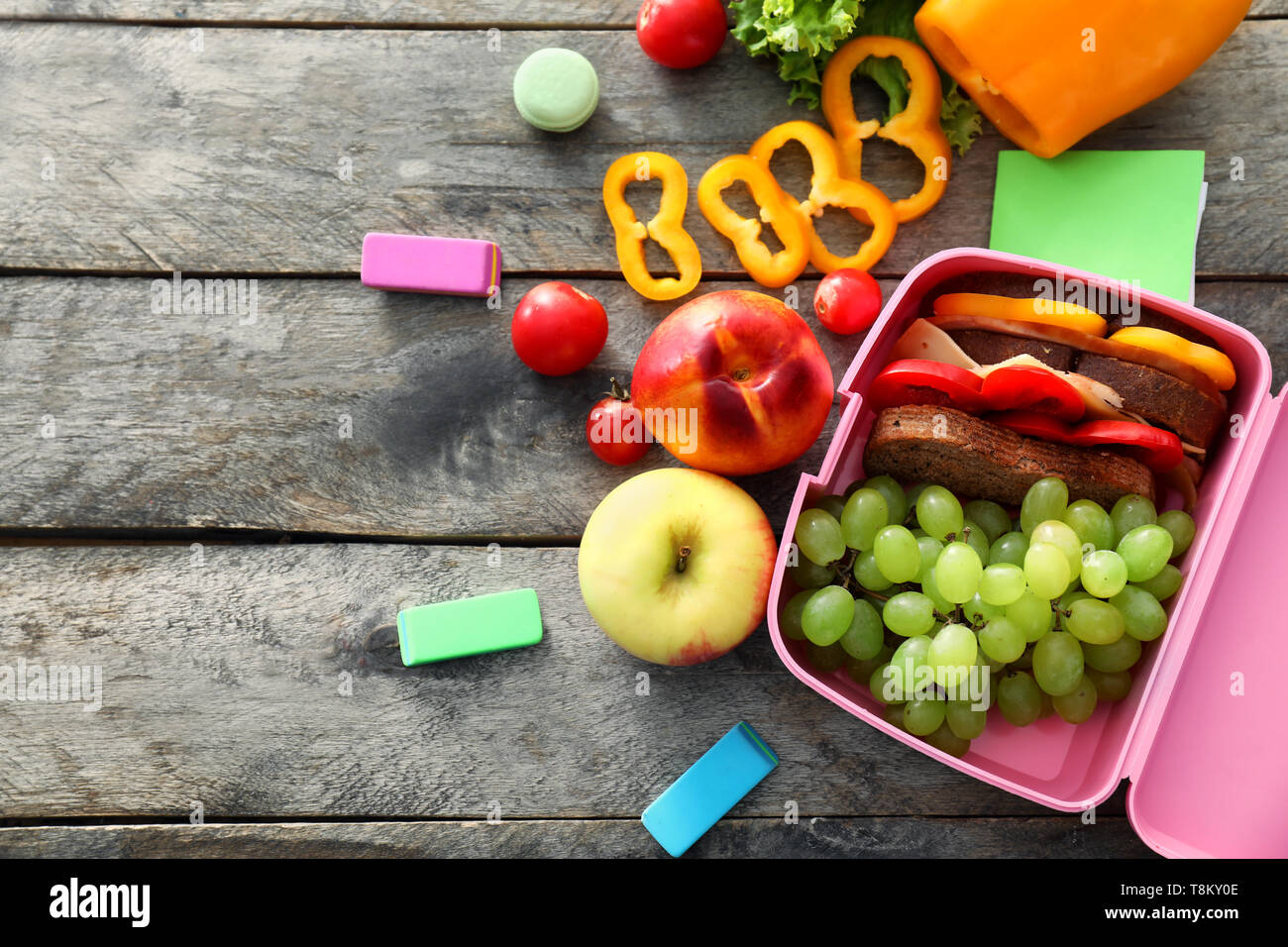 Lunch box with appetizing food on wooden table Stock Photo - Alamy
