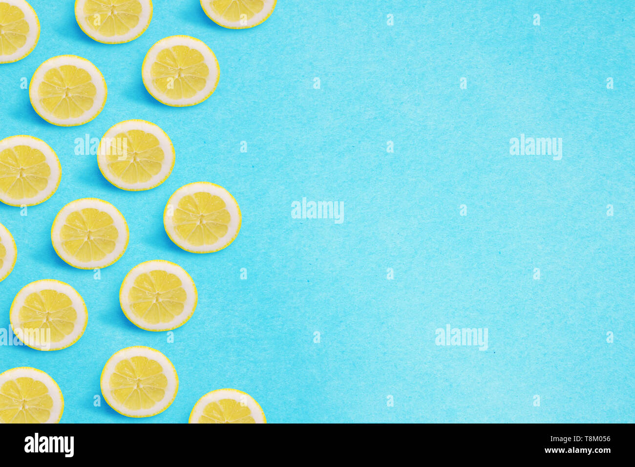 Lemon border on a bright blue background. Flat lay summer concept Stock ...