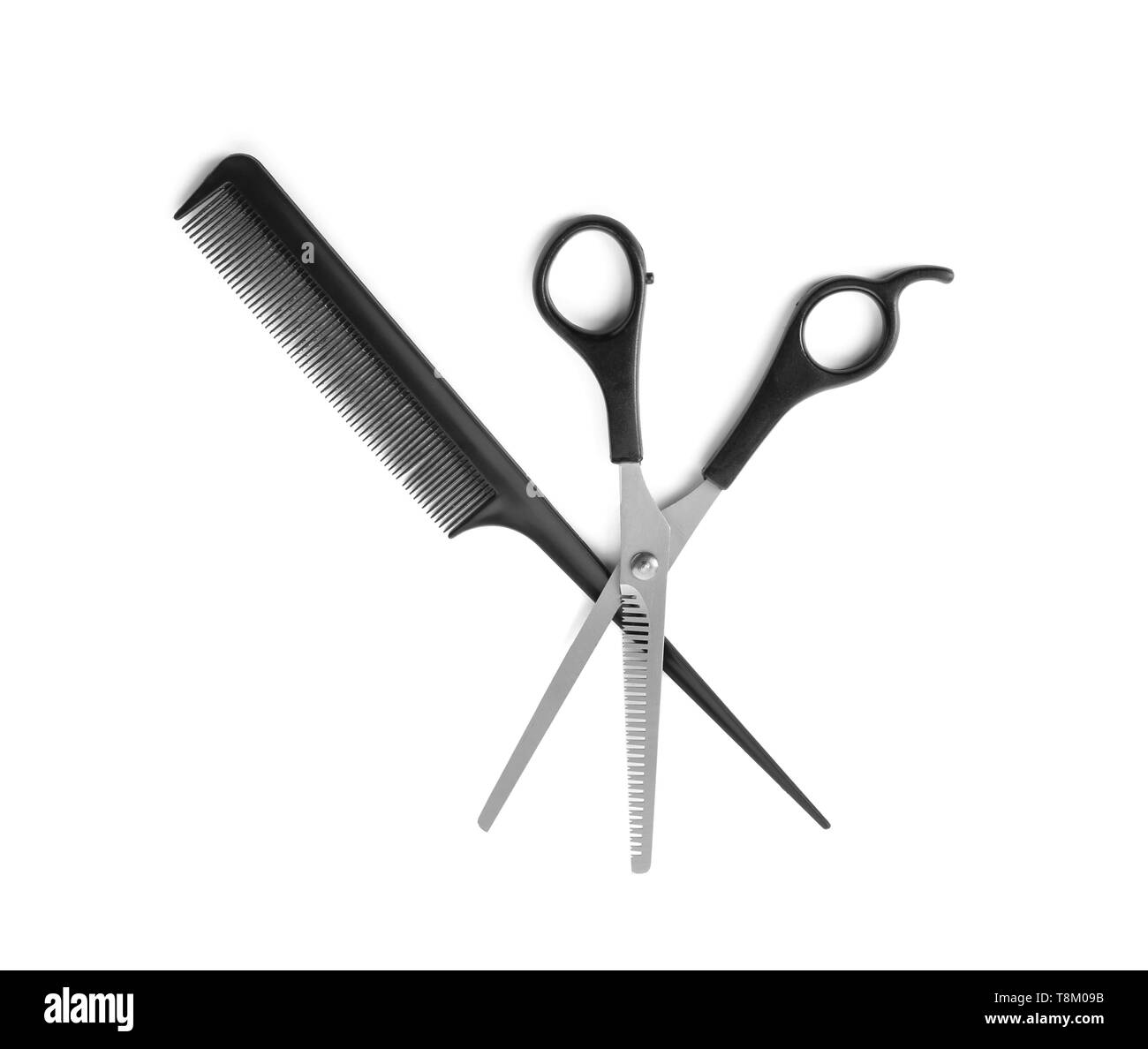 Professional hairdresser's scissors and hair comb on white background ...