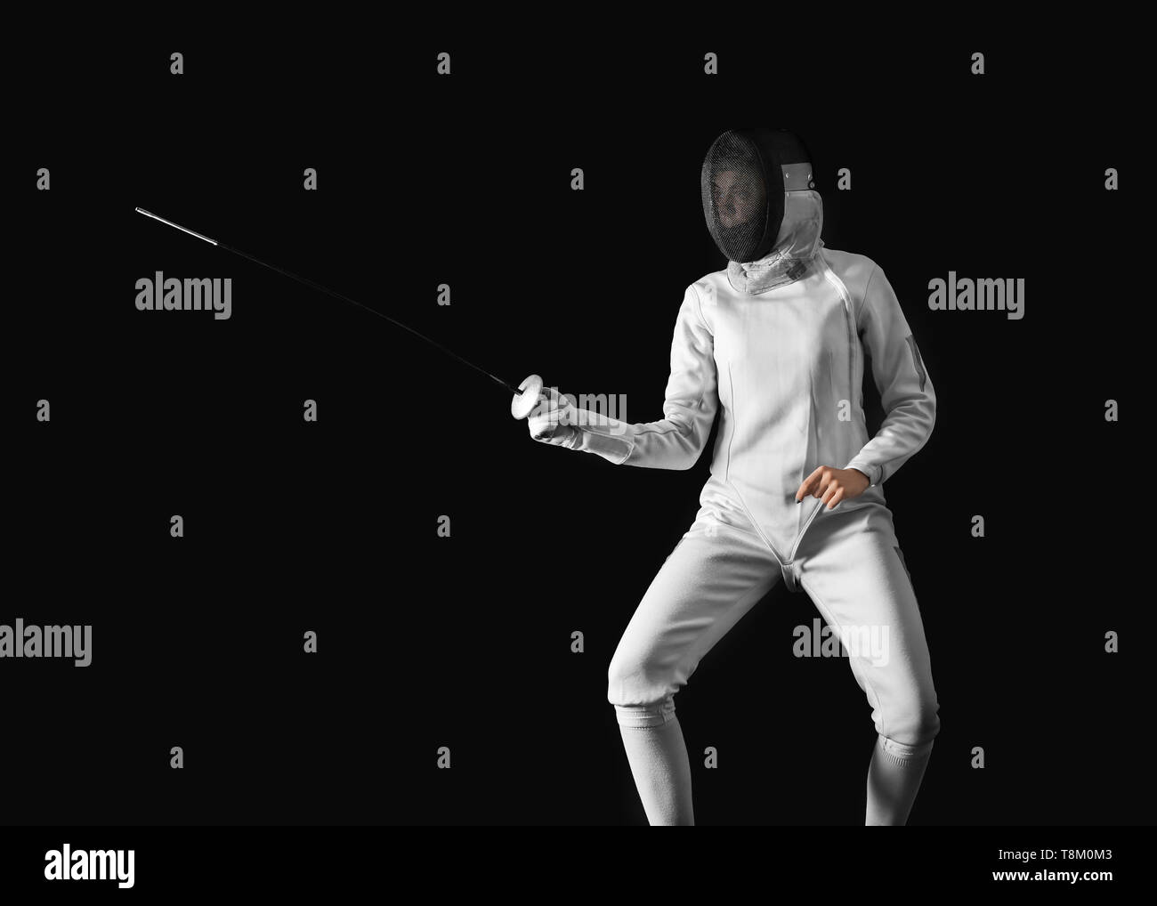 Young female fencer on dark background Stock Photo - Alamy
