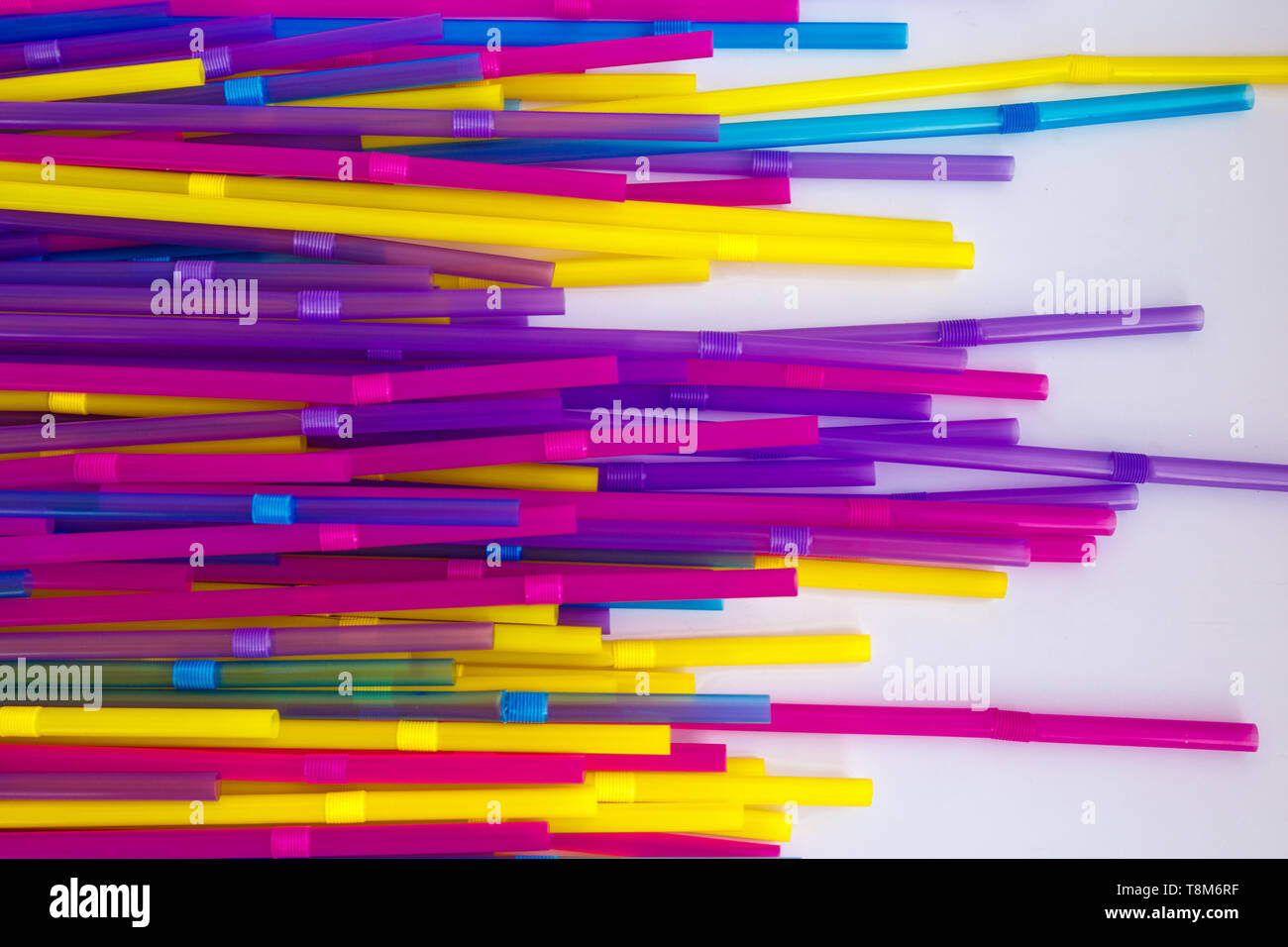 Set of colorful tubes for cocktails. Parallel and perpendicular lie on ...