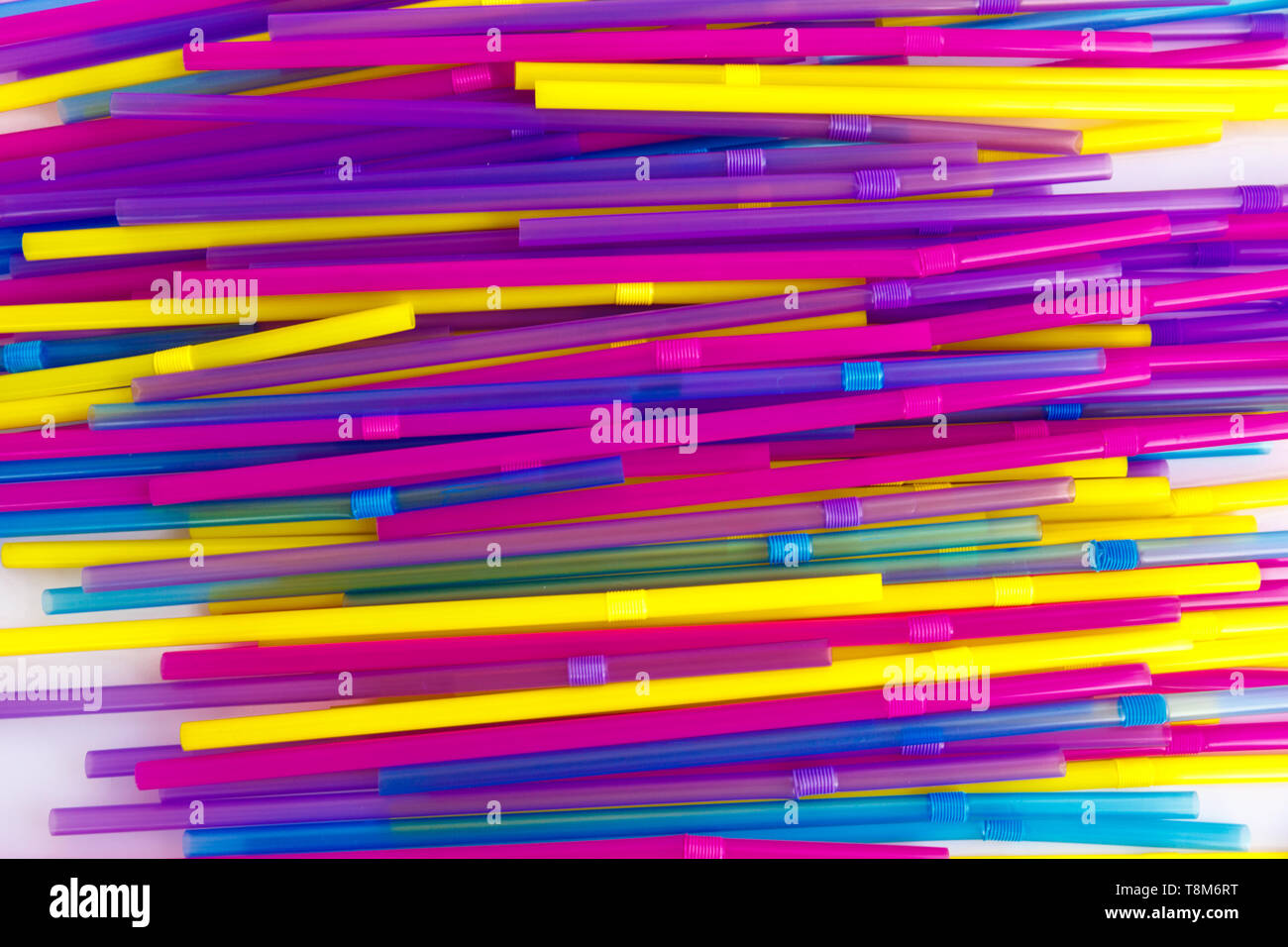 Set of colorful tubes for cocktails. Parallel and perpendicular lie on ...