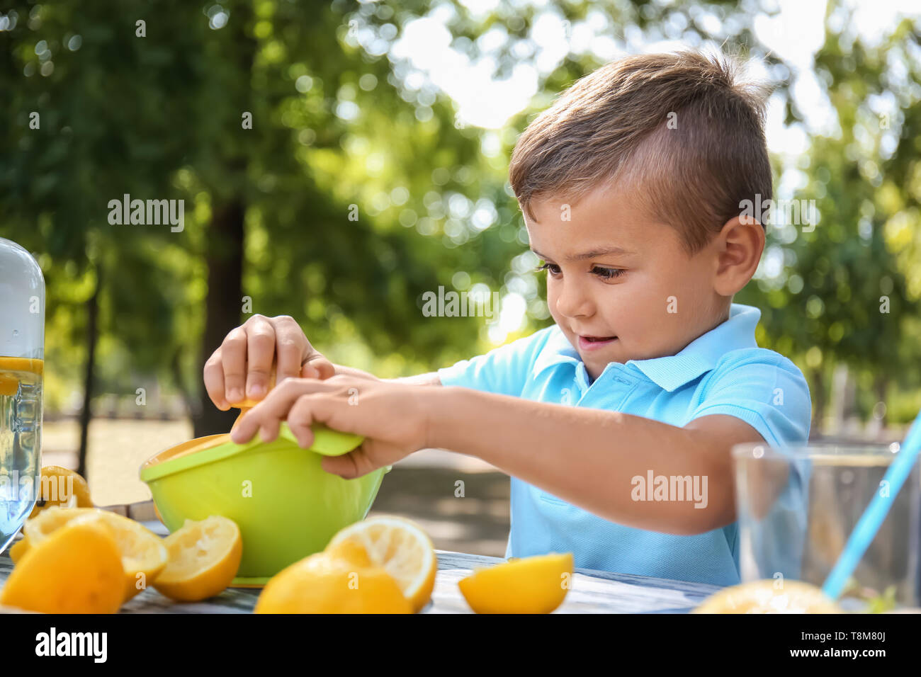 Lemon squeezing child hi-res stock photography and images - Alamy